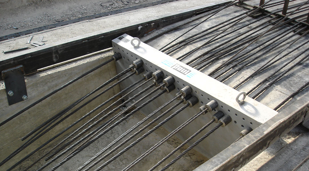 Reinforcement tensioning with a jack during production